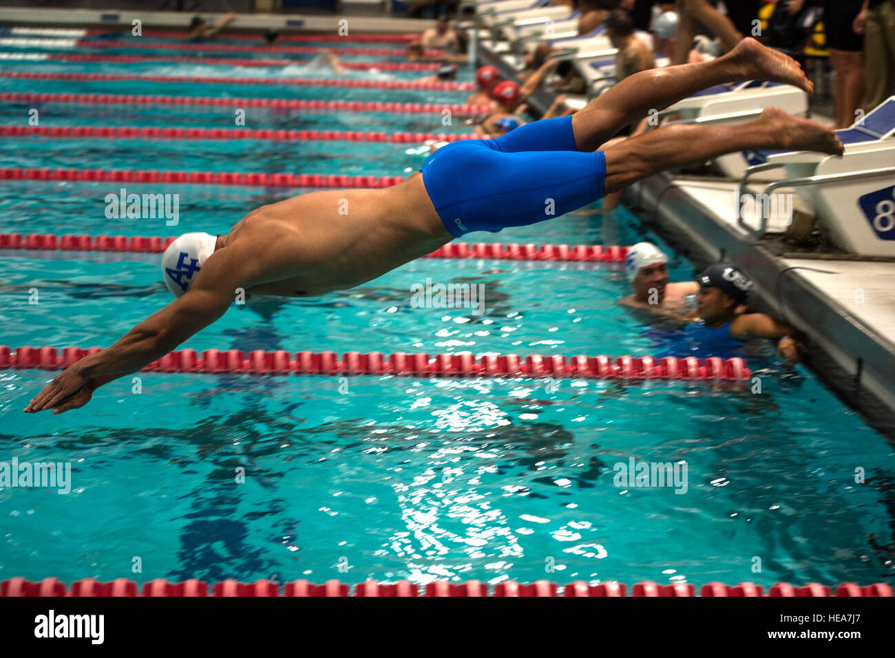 Air Force athlete Timothy Babb dives into a pool during competition ...