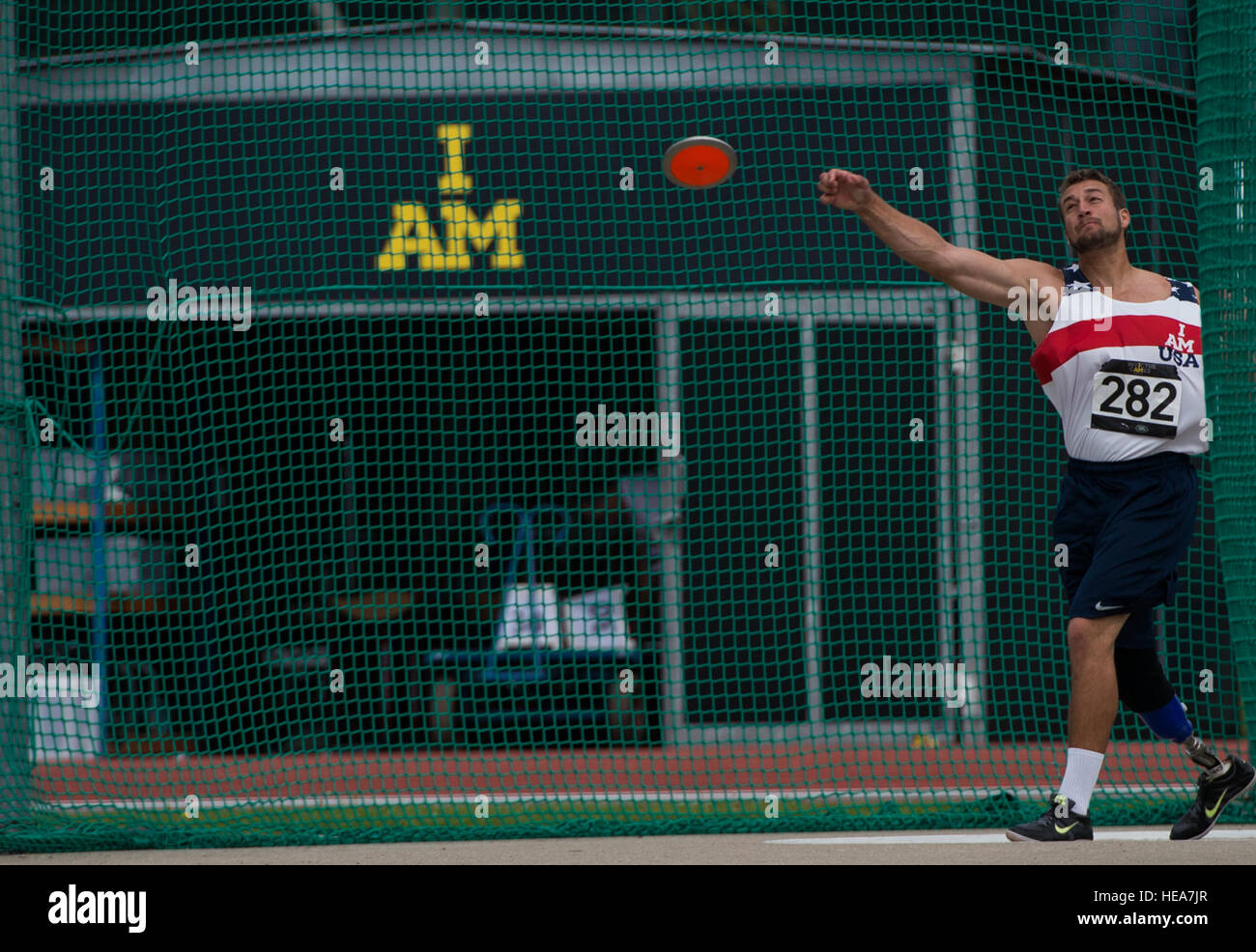 Former U.S. Navy Hospital Corpsman Max Rohn participates in a standing ...