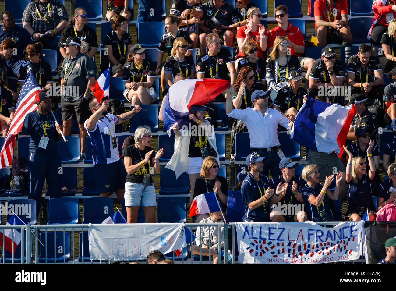 French fans cheer for their athletes competing in swimming events in ...