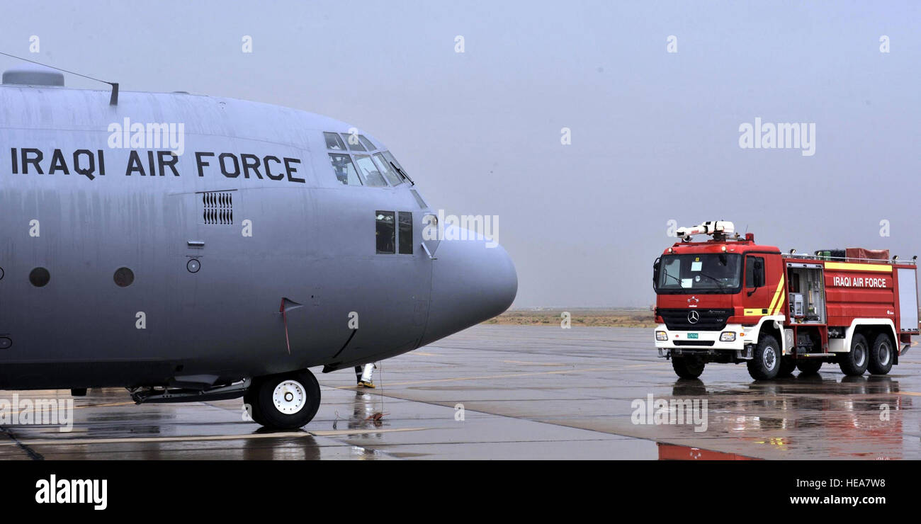 Iraqi air force firefighters respond to a simulated fire in the cargo ...