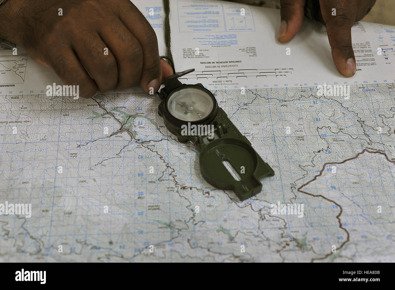 Iraqi air force airmen practice using a map and compass during the land ...