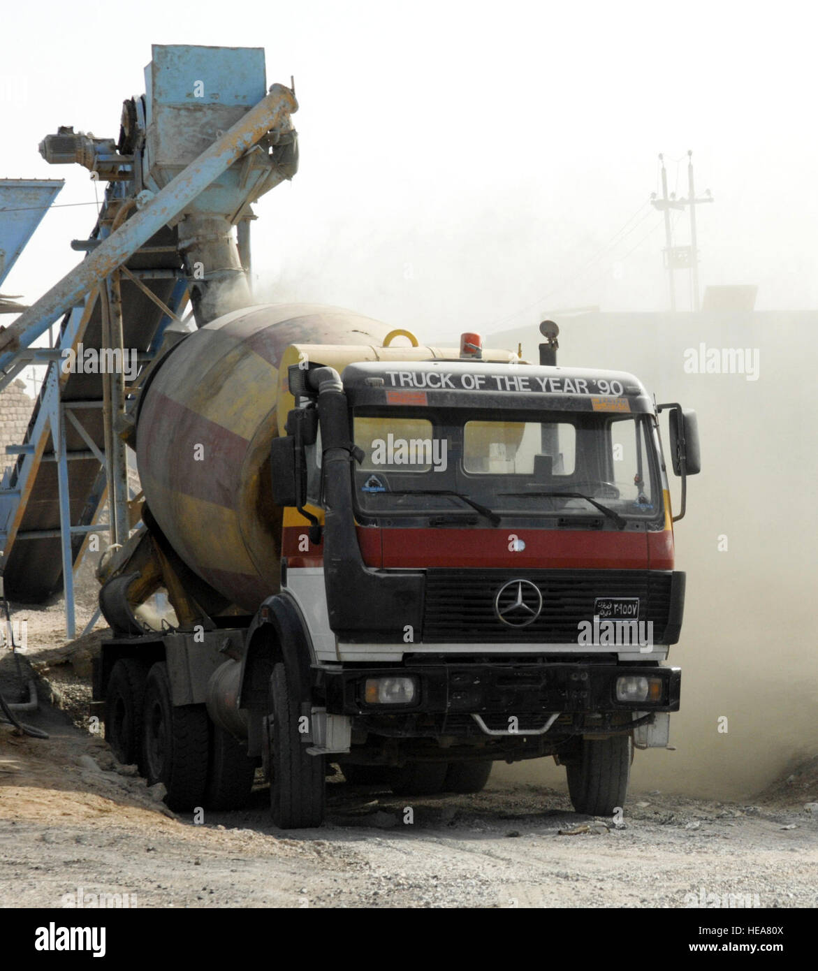 A cement truck fills up at Ali Air Base, Iraq, June 11, 2007, to make a ...