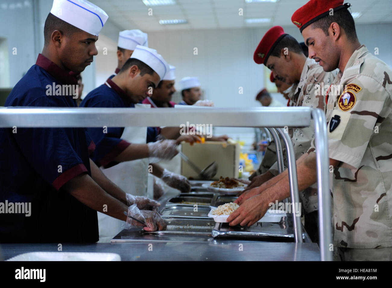 Iraqi soldiers eat lunch at their dining facility, at Camp Taji, near ...