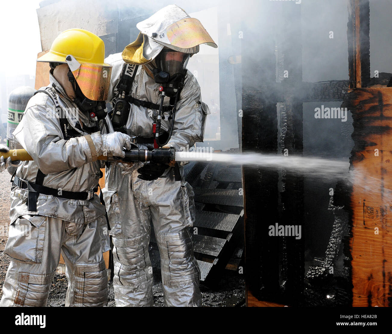A firefighter with the 332nd Civil Engineer Squadron, aids an Iraqi ...