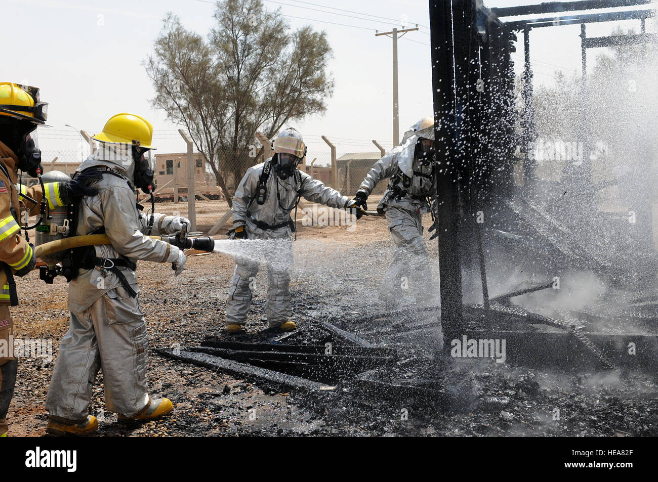 A firefighter with the 332nd Civil Engineer Squadron, points out the ...