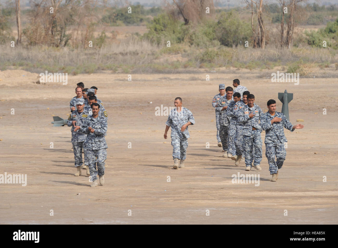Iraqi policemen practice a column formation at the Iraqi Police Academy ...