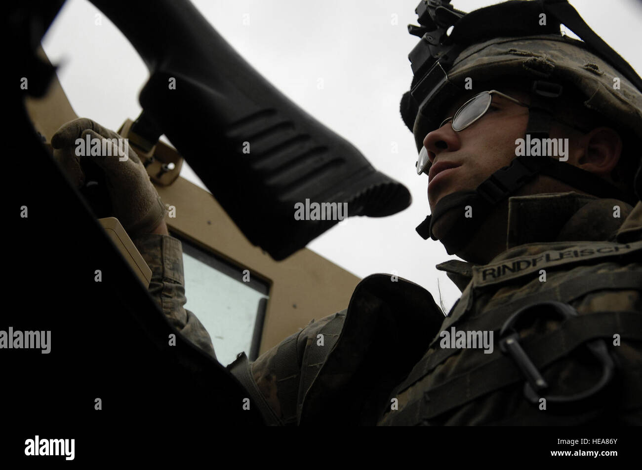 Spc. Andrew Rindfleisch scans his area of fire during a mission with ...