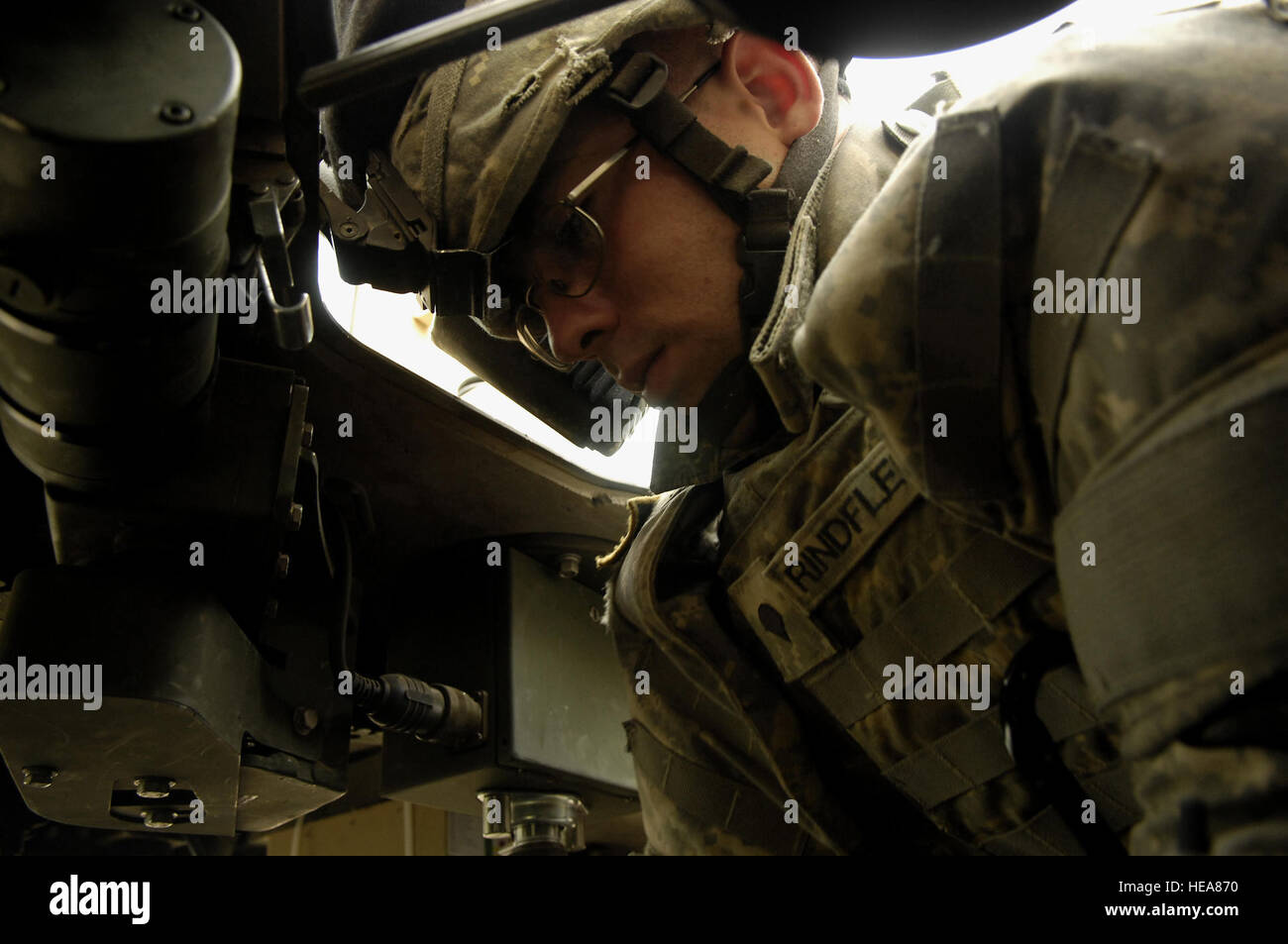 Spc. Andrew Rindfleisch monitors the radios during an Iraqi police led ...