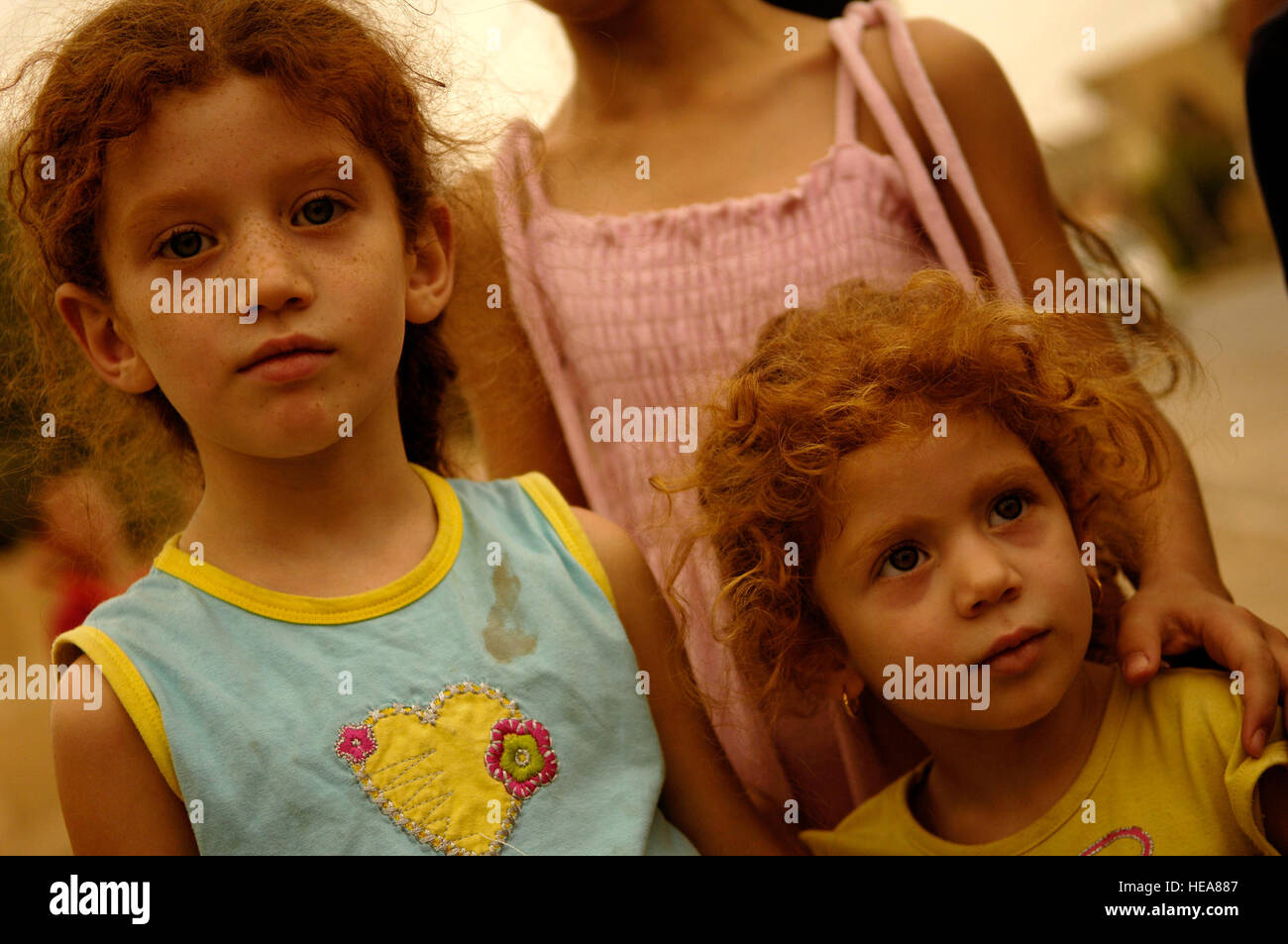 A young Iraqi girl and her sister in the Christian village of Qaraqosh ...