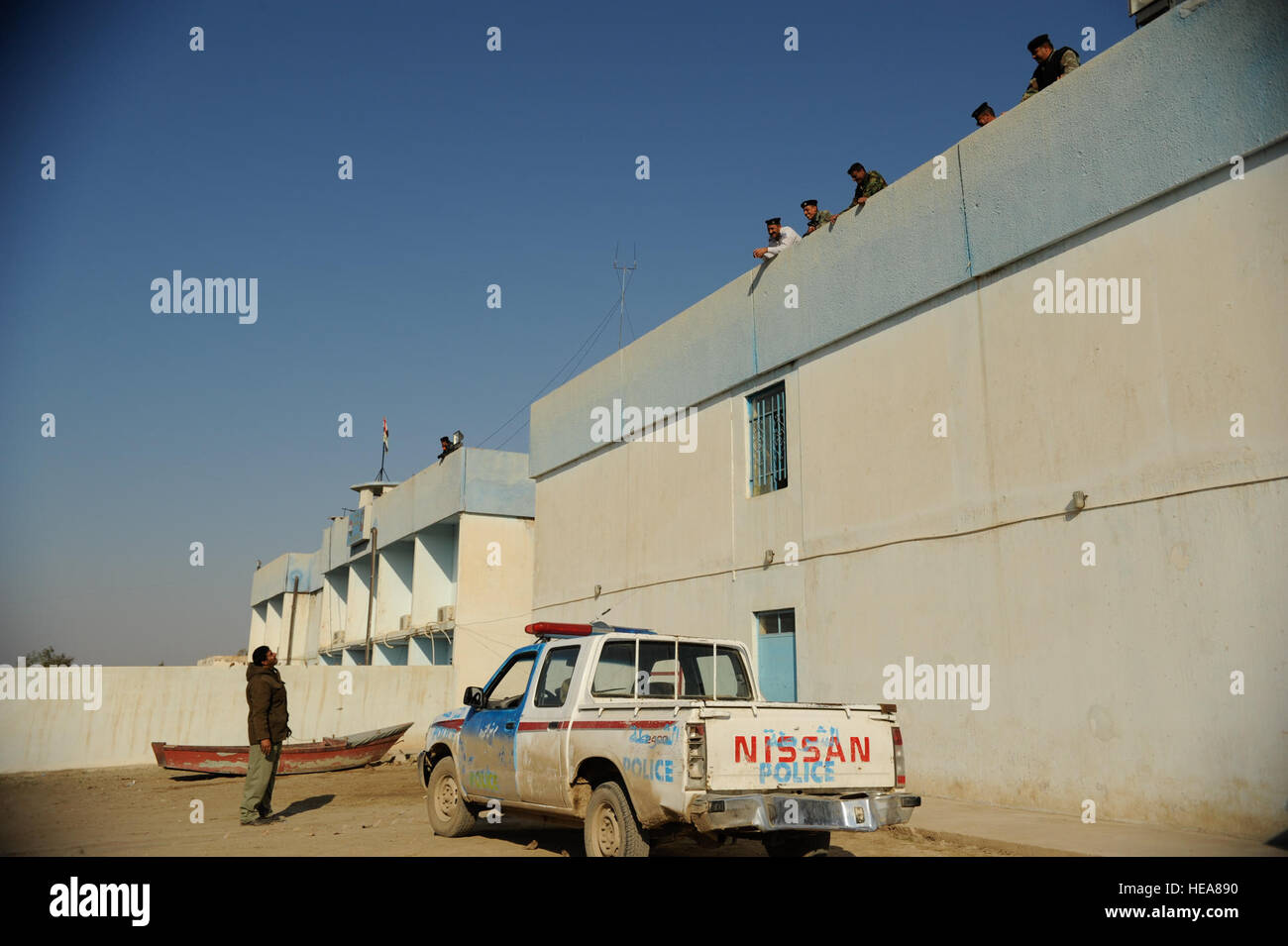 Iraqi policemen chat with each other at an Iraqi police station in ...