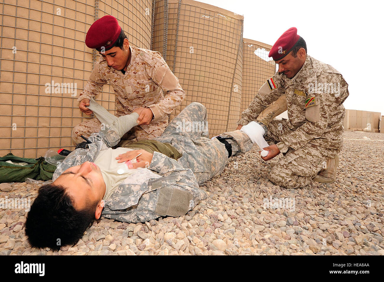 Iraqi soldiers from 4th Iraqi Army Engineer Regiment, treat a mock ...