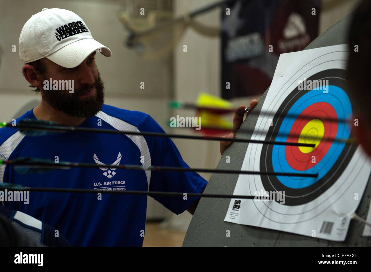 Air Force athlete Ryan Gallo looks over his shots for an archery ...