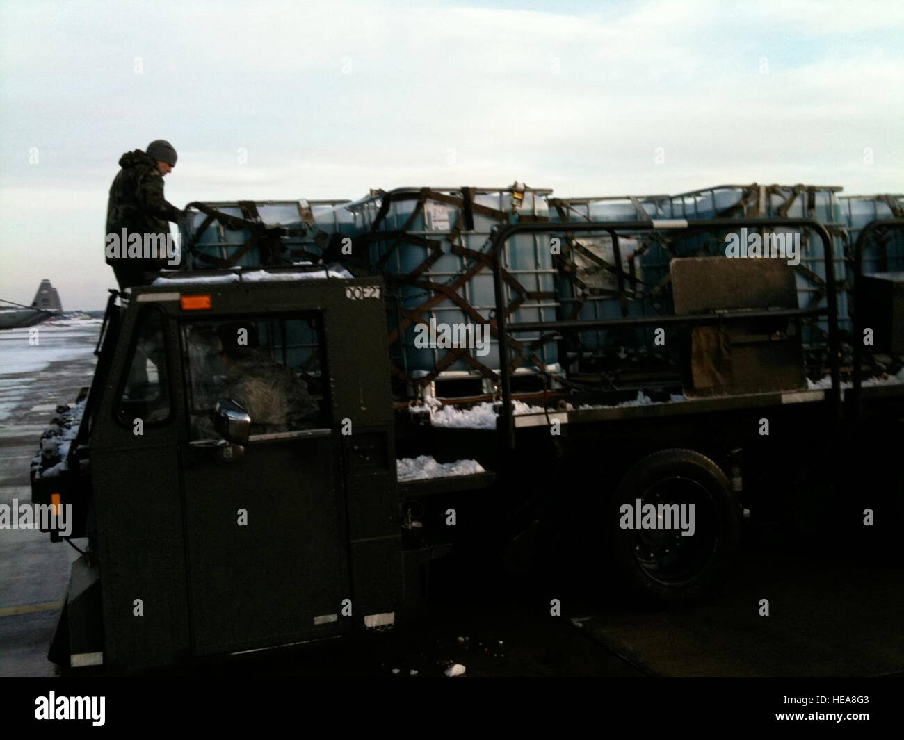 U.S. Air Force personnel at Ramstein Air Base, Germany, load ...