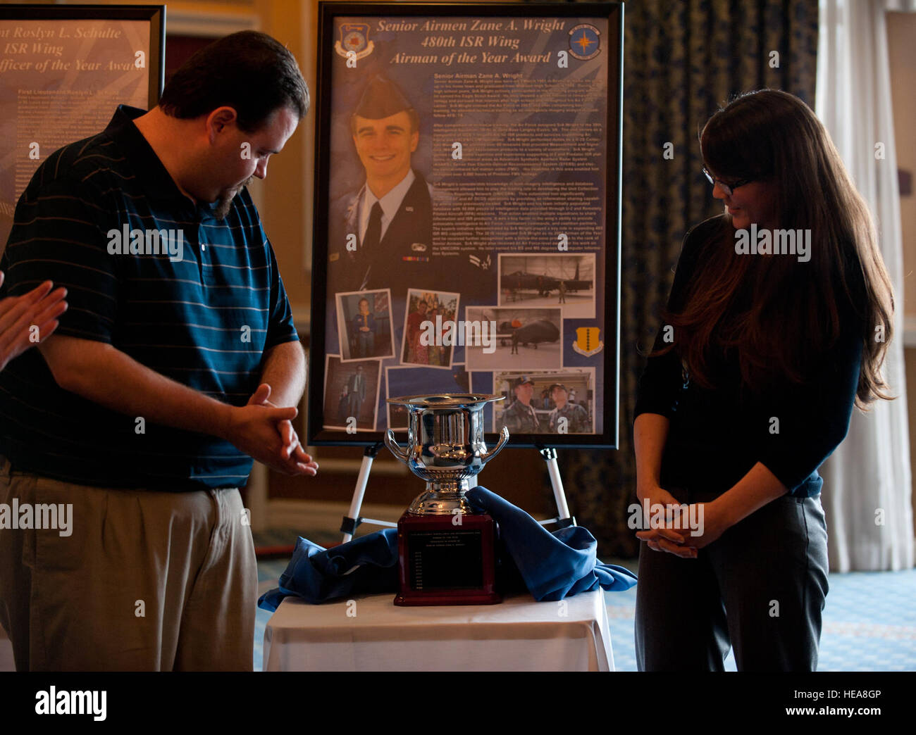 Victoria Wright, wife of Senior Airman Zane Wright, looks at the annual ...