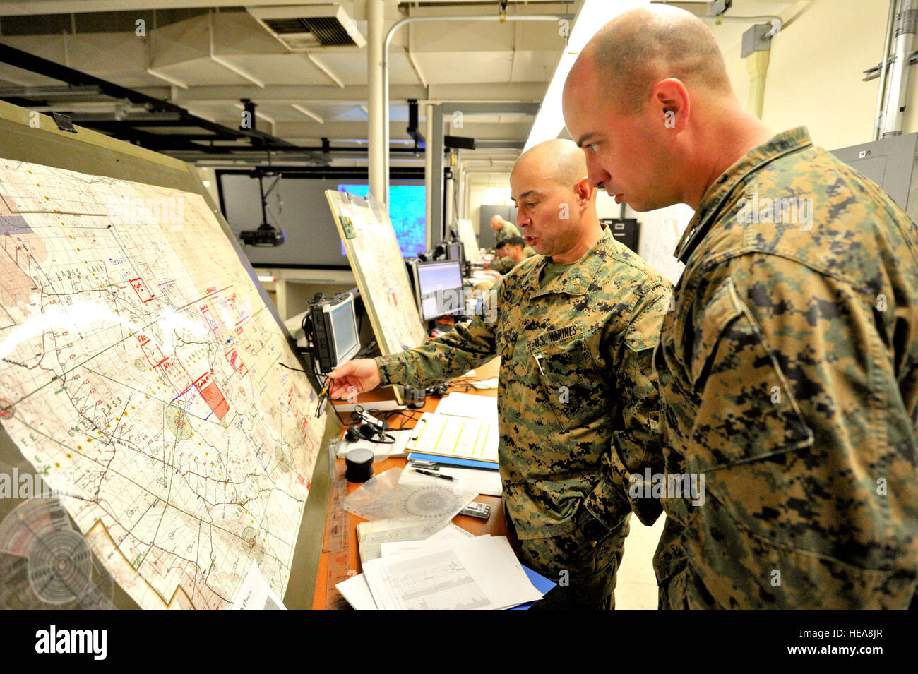 U.S. Marines verify target clearing points on a range map during ...
