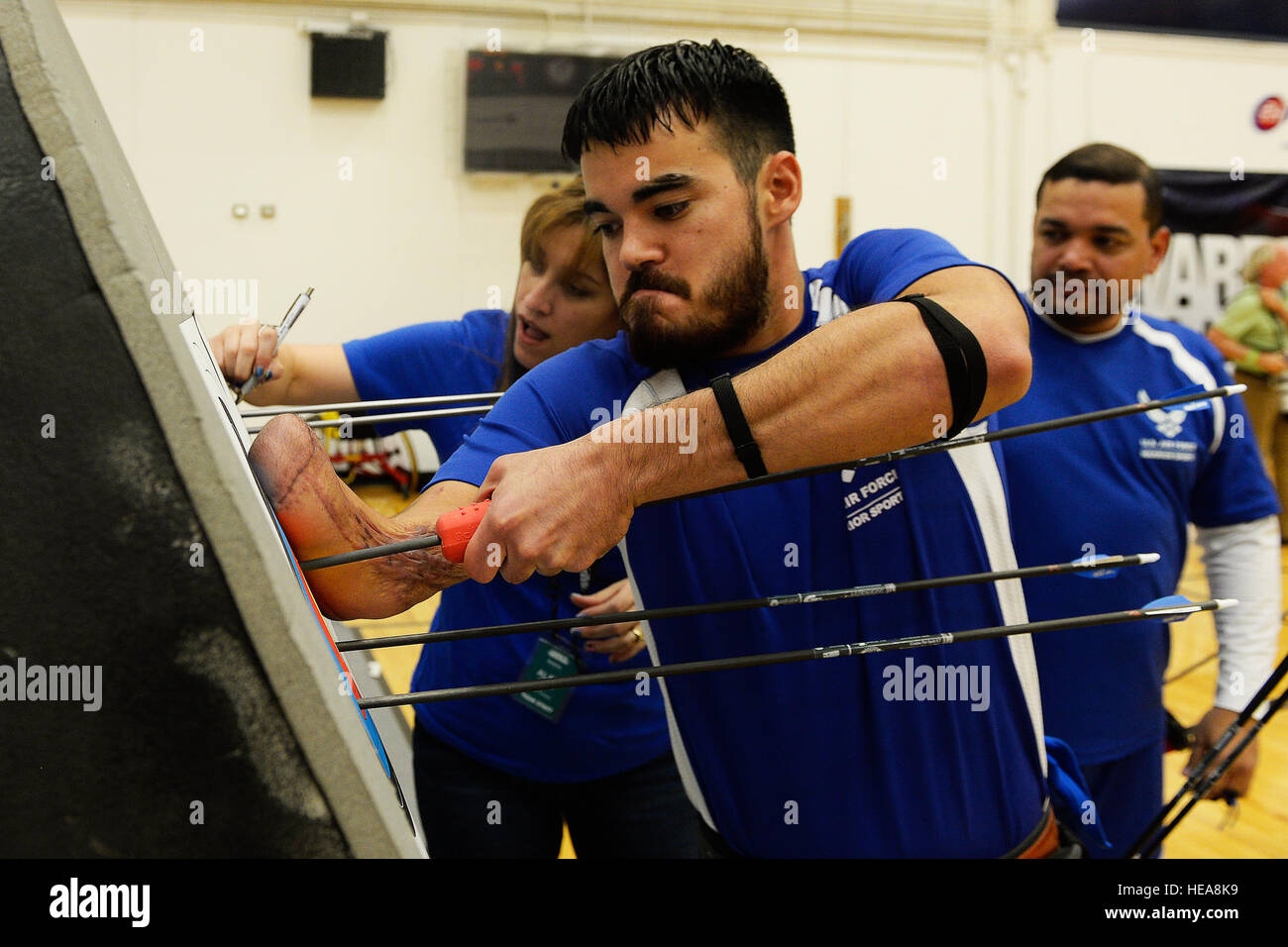 Air Force Athlete Daniel Crane retrieves his arrows from his target ...