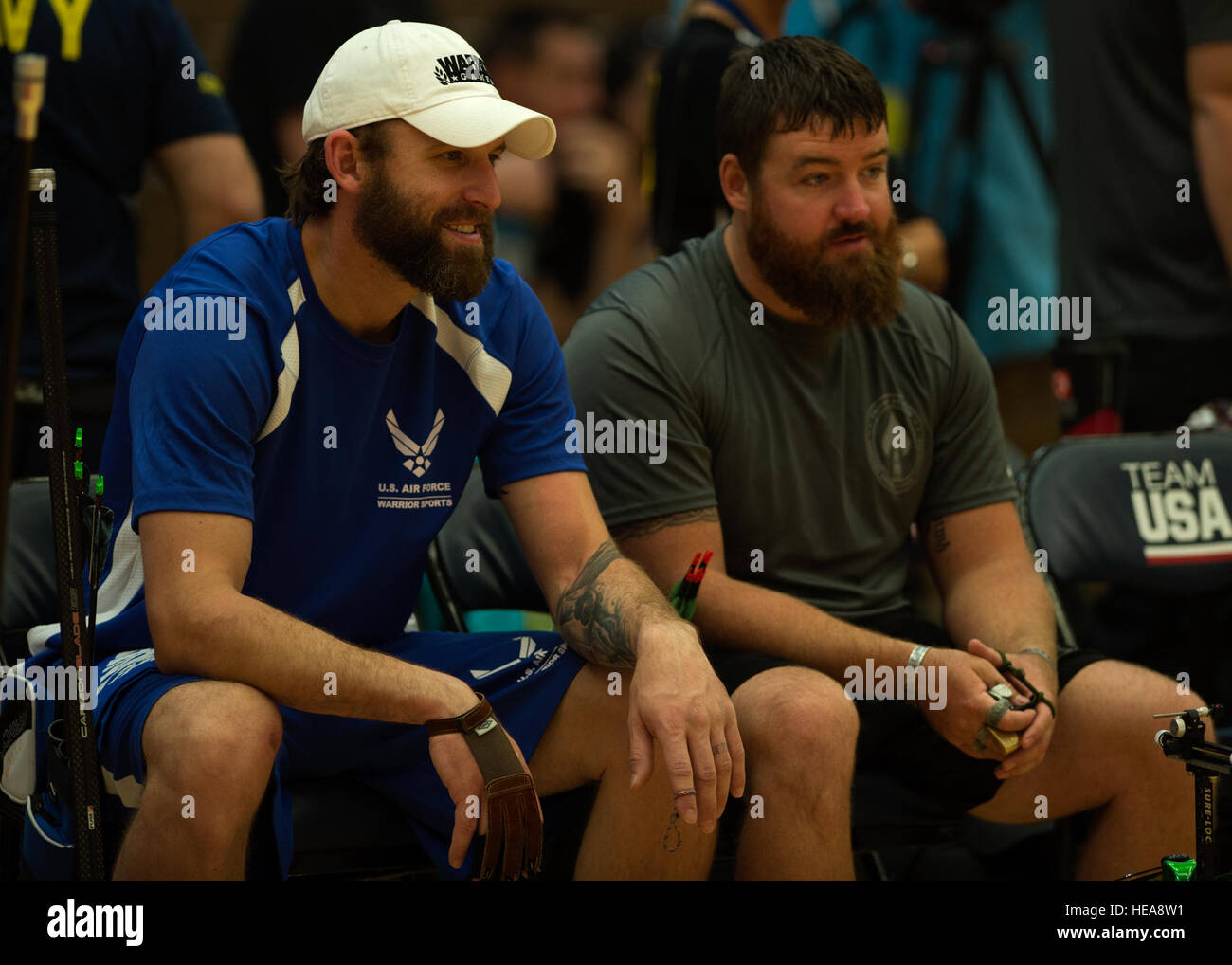Air Force athlete Ryan Gallo (left) watches fellow archers during the ...