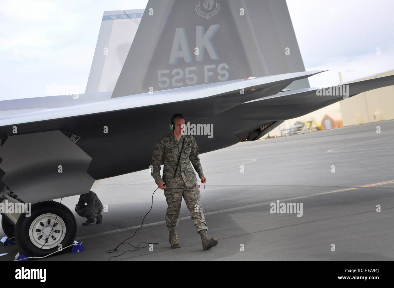 Senior Airman Joshua King performs post flight checks on an F-22 on the ...