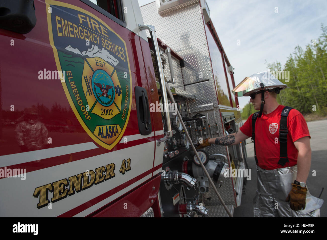 Adam Hall, a firefighter assigned to the 673rd Civil Engineer Squadron ...