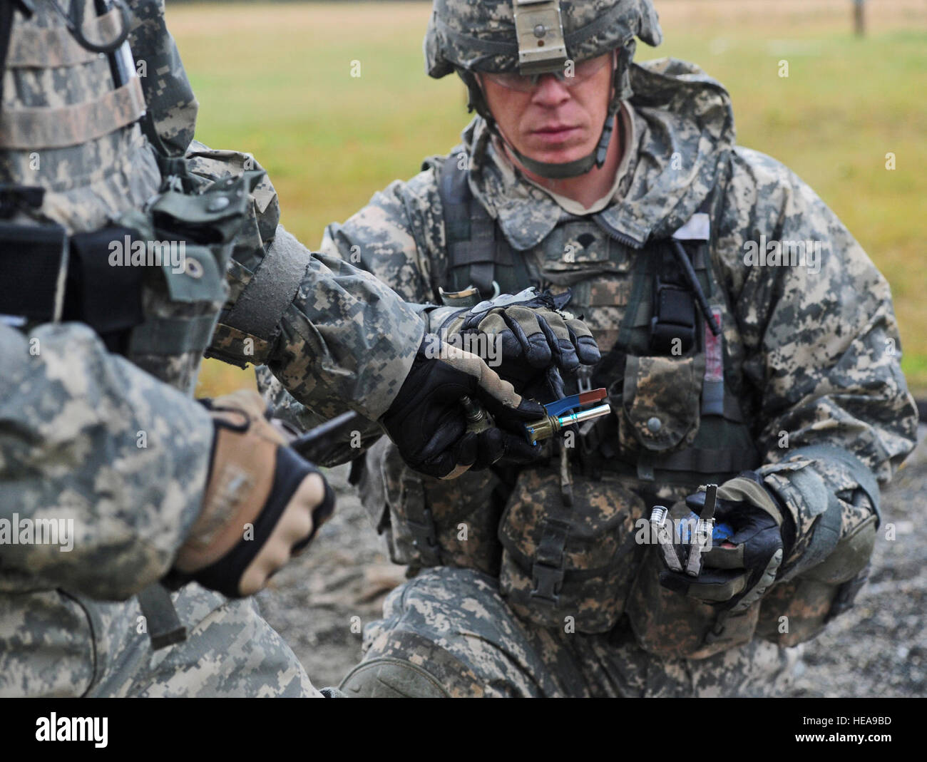 Soldiers of the 545th Military Police Company load fuses into practice ...