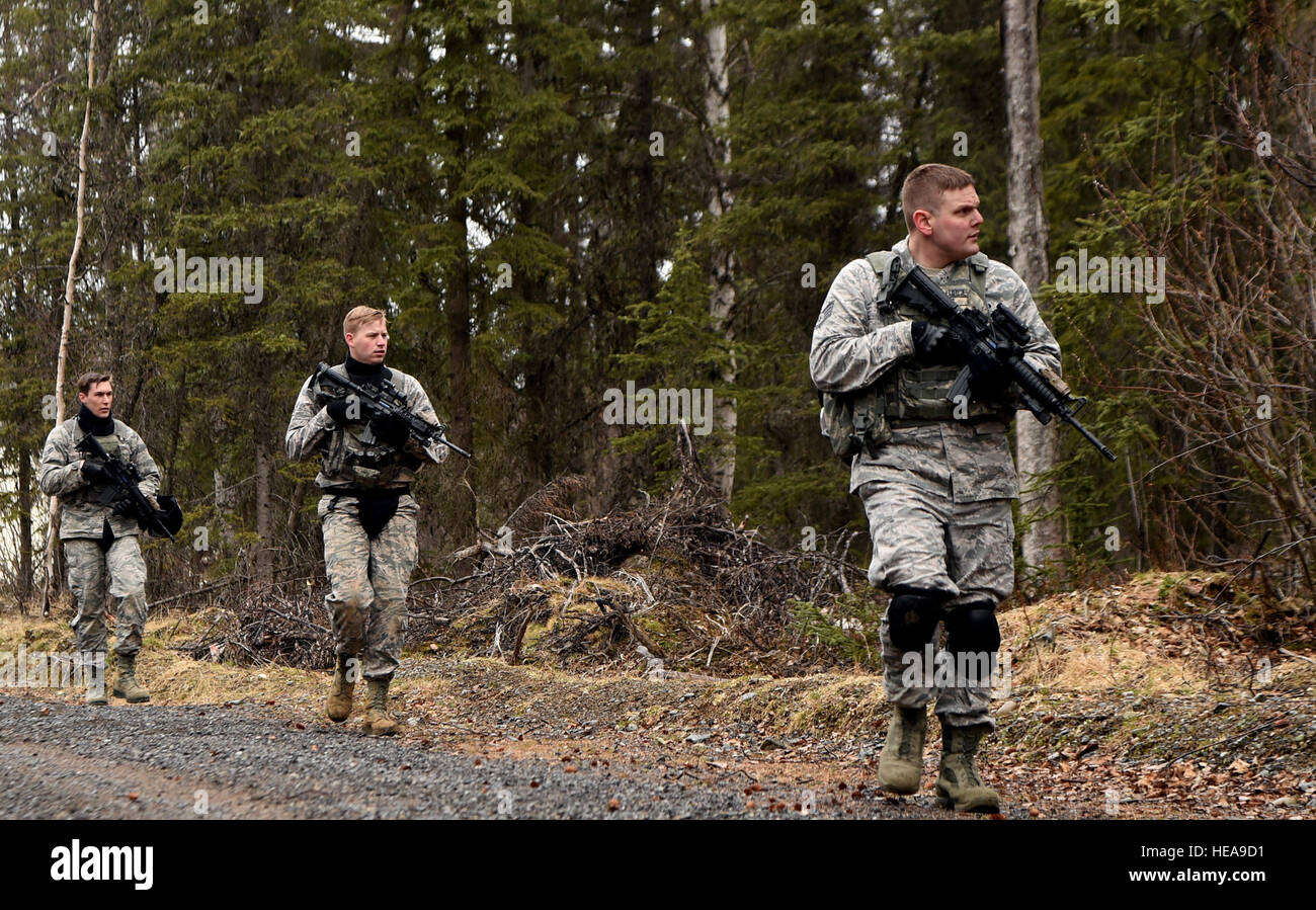 Security Forces personnel conduct patrols in staggered column formation ...