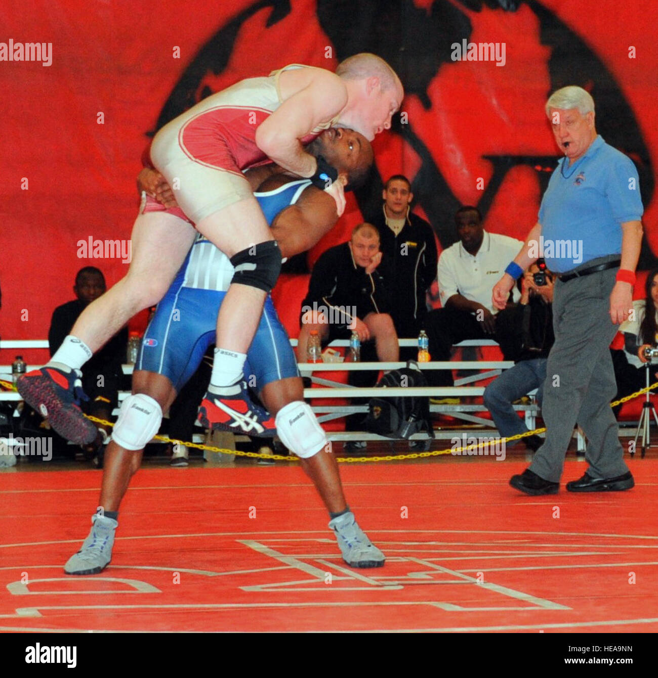 Navy's Darnell Jones executes a single leg lift on Army's Nate Engel in ...