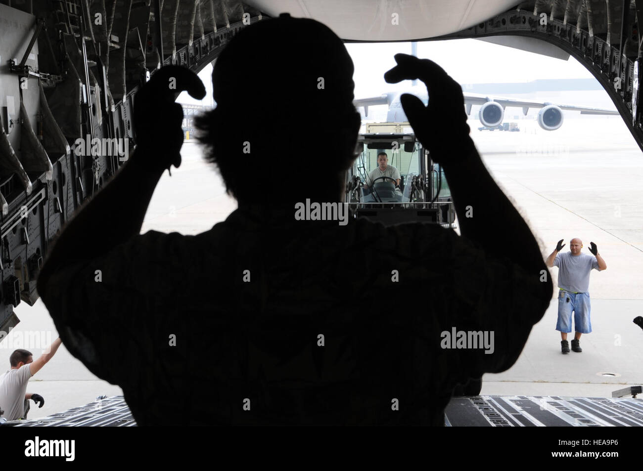 Joint Base McGuire-Dix-Lakehurst airmen load and secure equipment onto ...