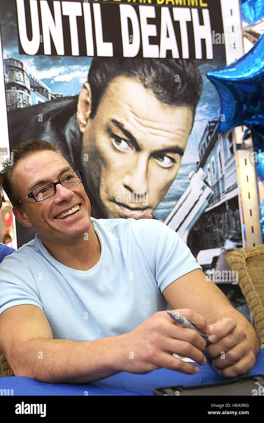 Airman 1st Class Joseph Langston poses for a picture with actor Jean ...