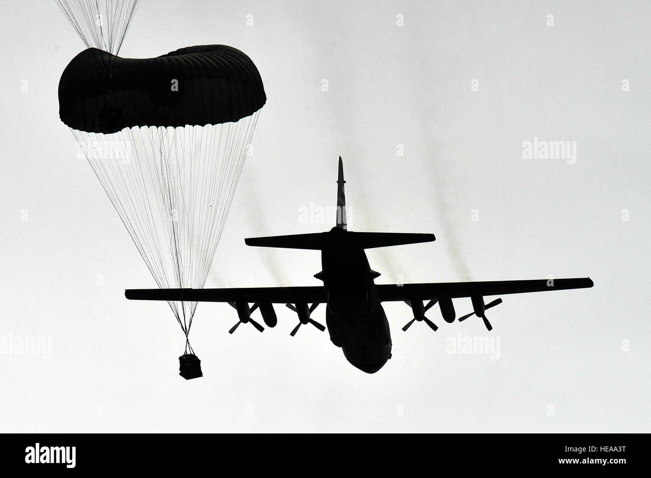 A C-130 Hercules from the U.S. Air Force conducts an equipment drop for ...