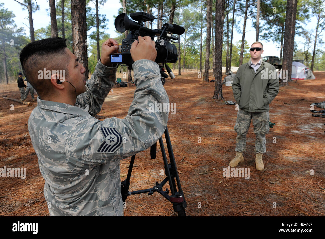 U.S. Air Force Tech. Sgt. Michael Garza, left, a combat broadcaster ...