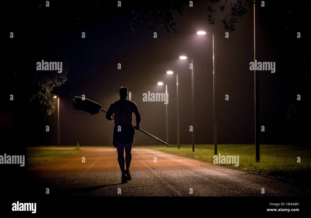 An Airman carries the Prisoner of War/Missing in Action flag during the ...