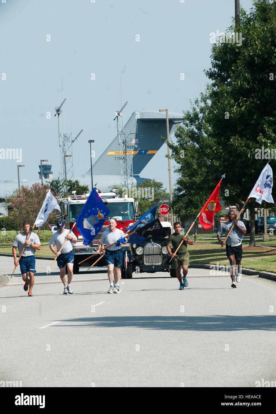 Members from each military branch run with their respective service ...