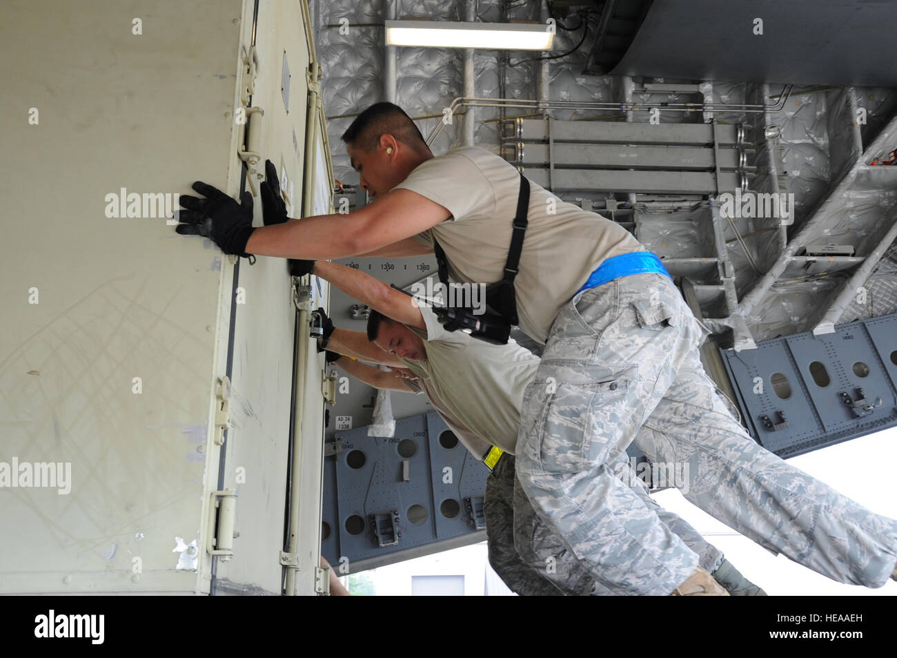 Joint Base McGuire-Dix-Lakehurst airmen load and secure equipment onto ...