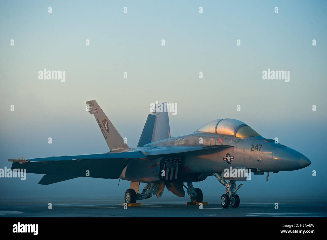 An F/A 18 Super Hornet sits in the morning fog at the Power in the ...