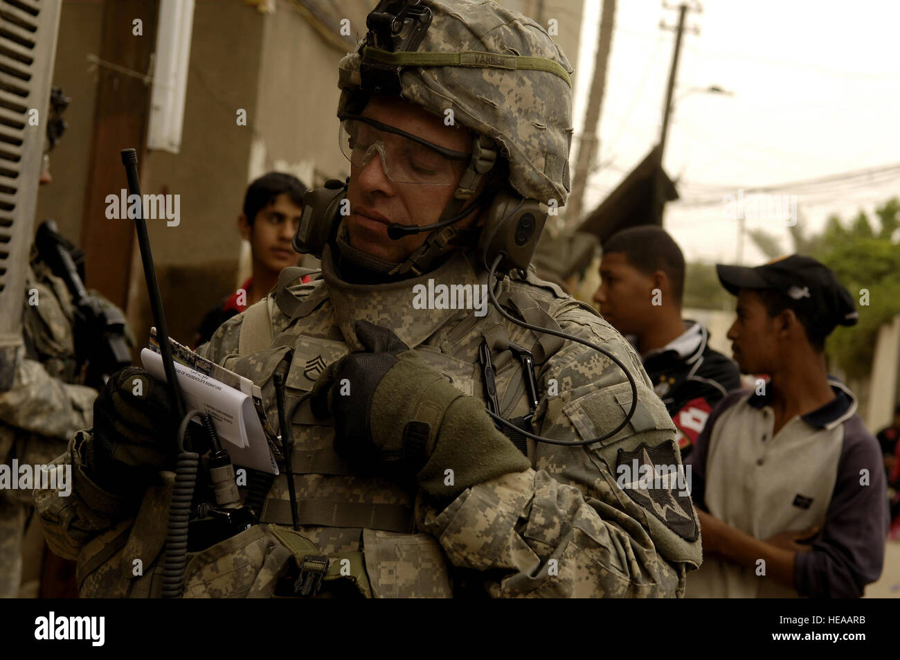 U.S. Army Staff Sgt. Ronald Varner reviews a map of the East Mansour ...