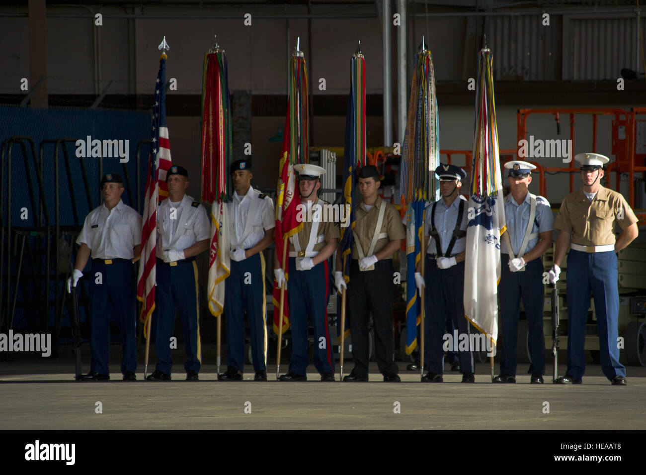 A joint service color guard team prepares to present the colors during ...