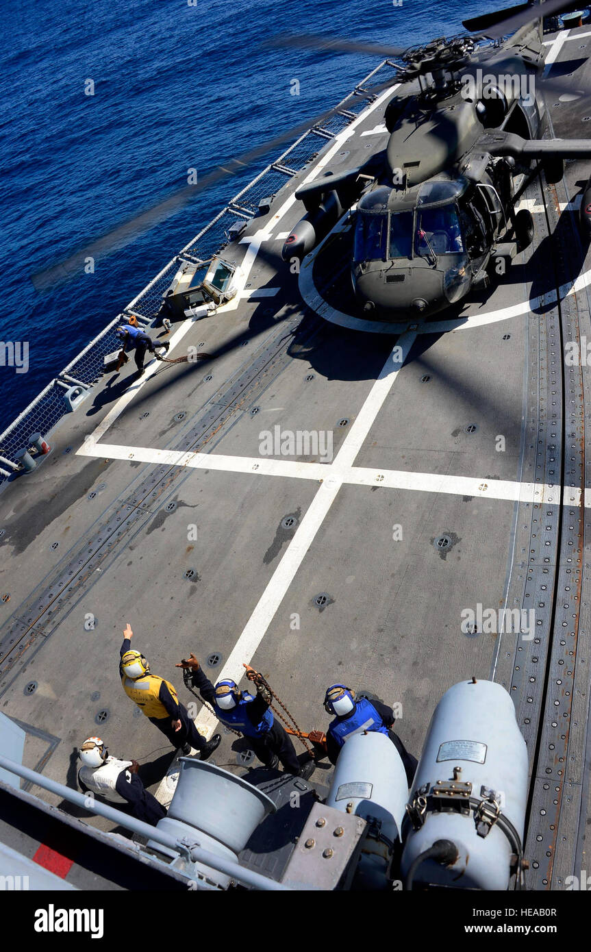A U.S. Navy aircraft handling officer, assigned to the USS Kauffman ...