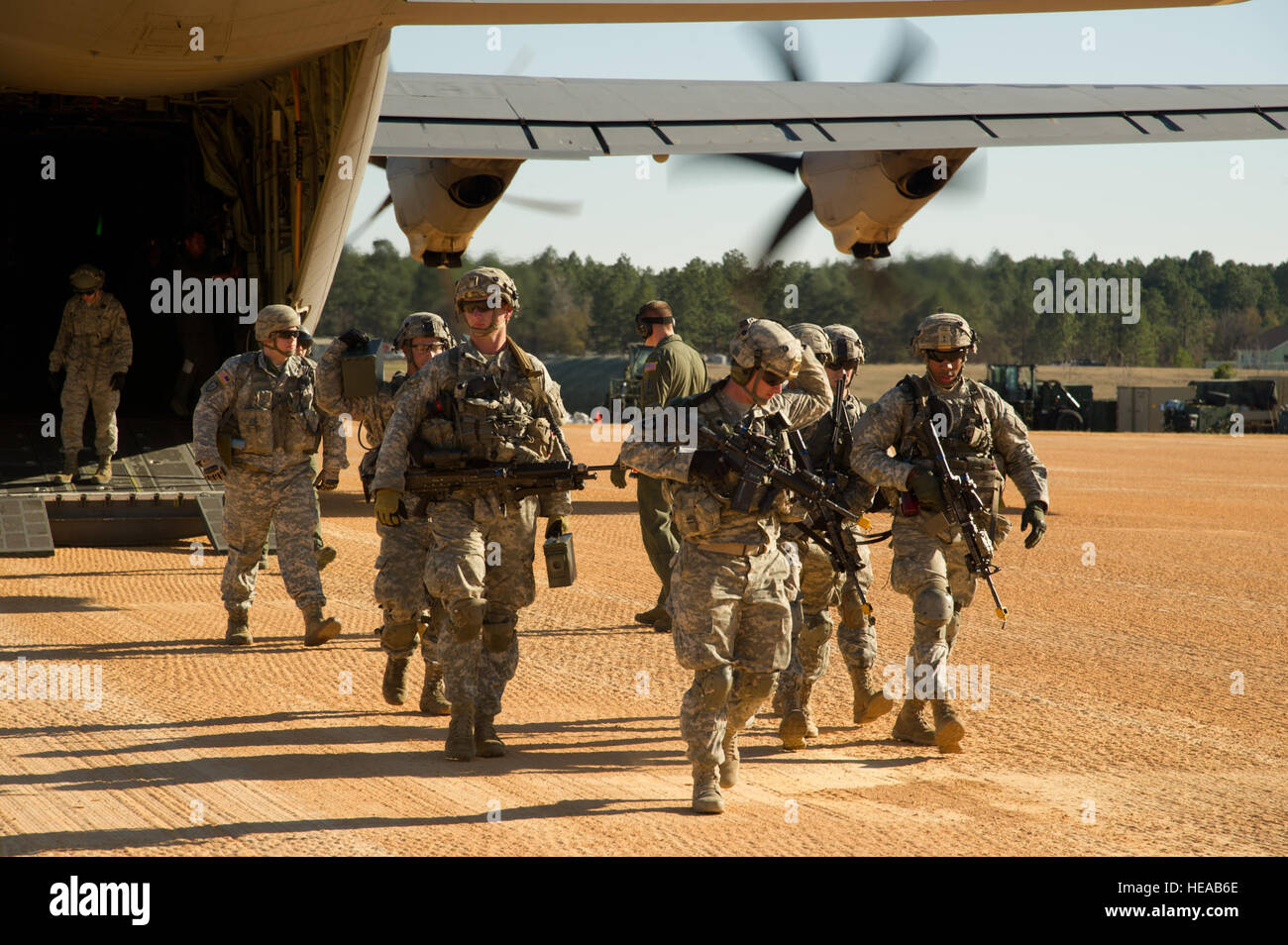 U.S. Army Soldiers perform an engine running offload from a C-130J ...