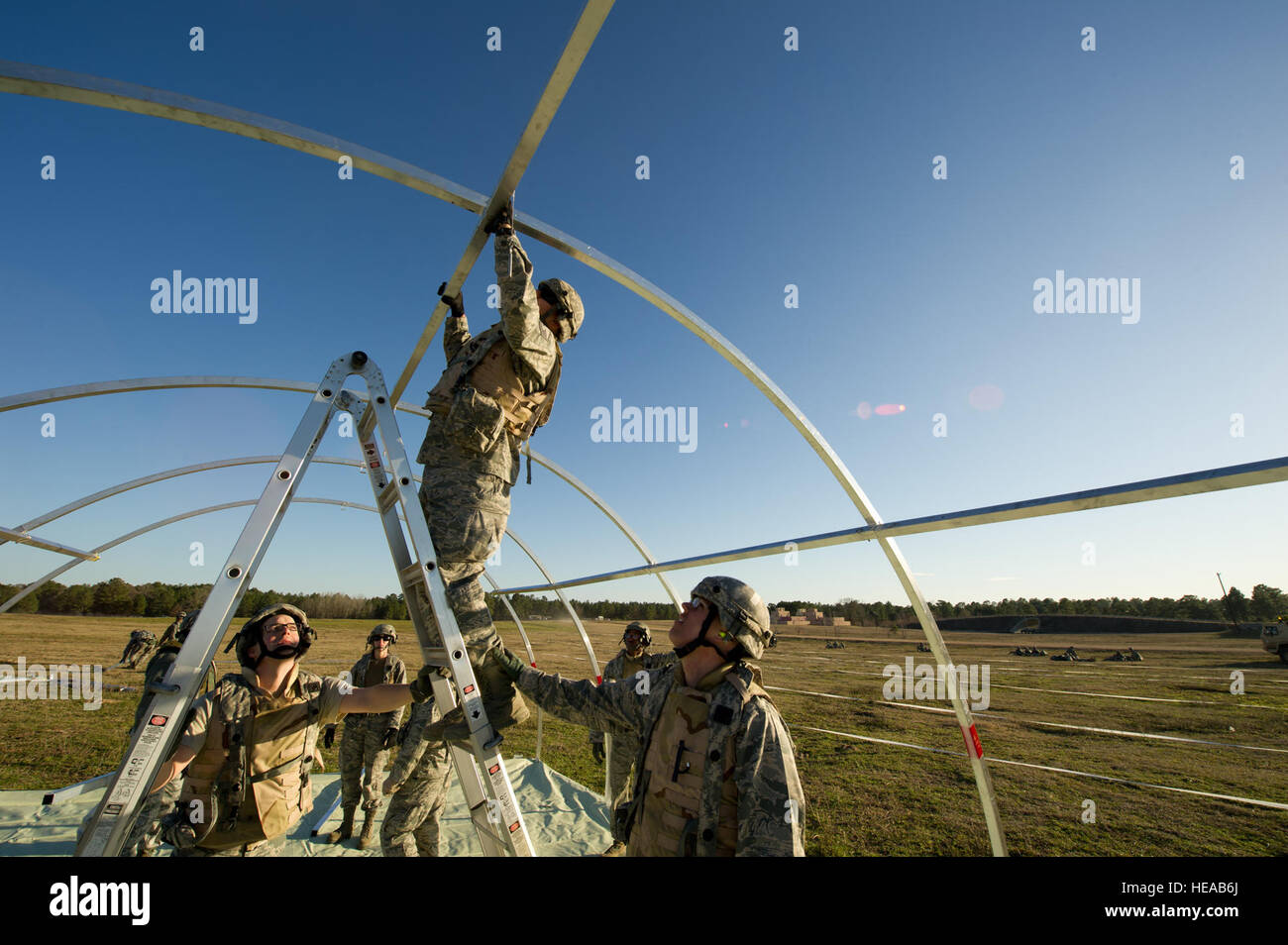 U.S. Air Force Airmen set up an Alaskan tent during a field exercise at ...