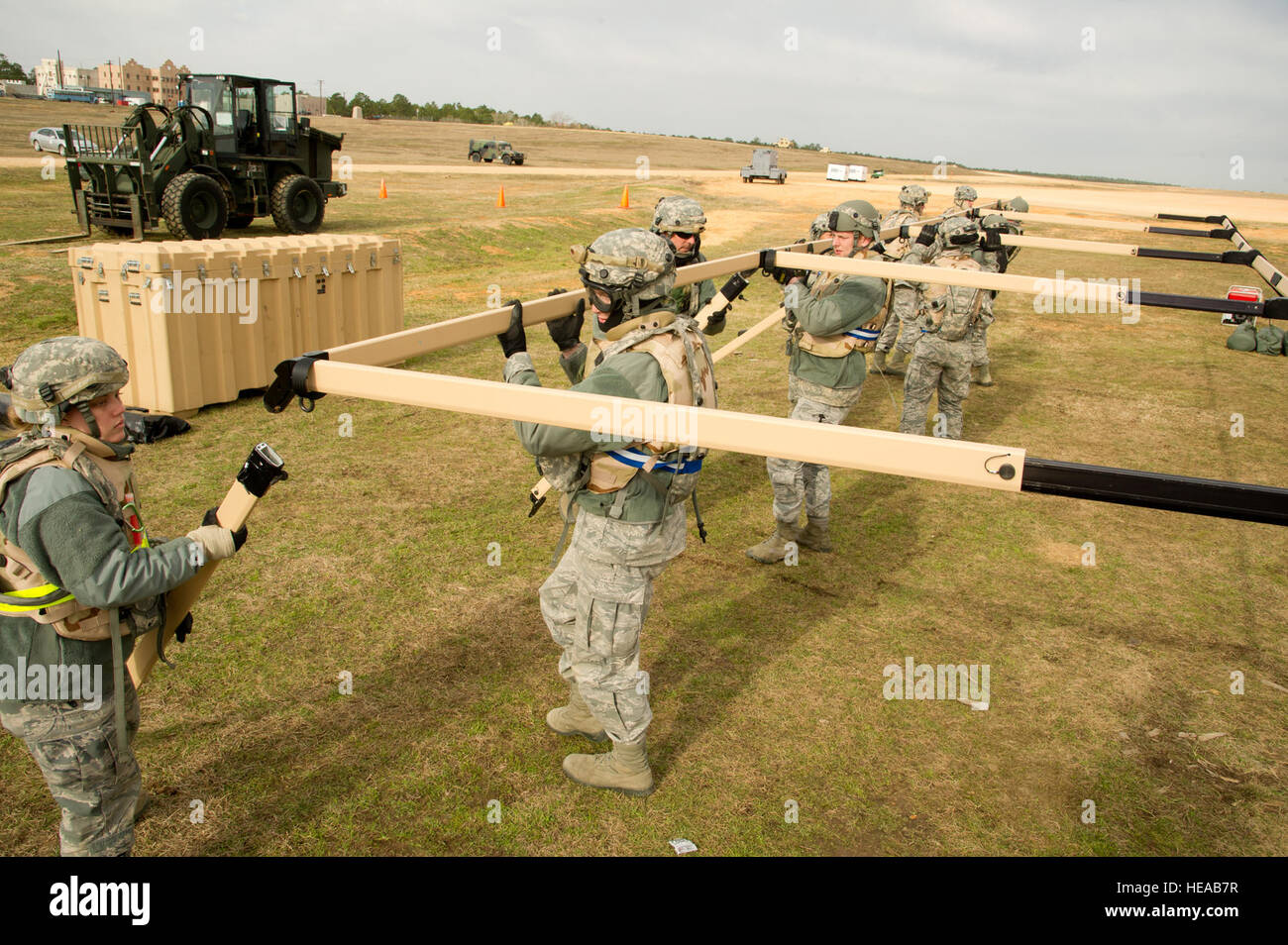U.S. Air Force Airmen construct an Utilis TM60 Tall tent during a field ...
