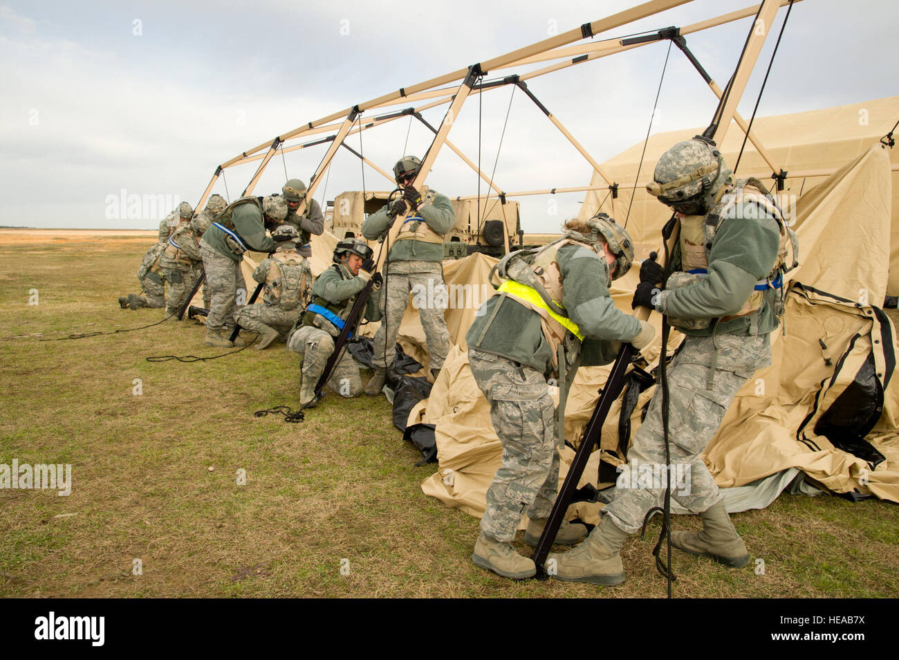 U.S. Air Force Airmen construct an Utilis TM60 Tall tent during a field ...