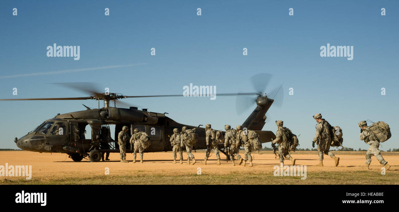 U.S. Army Soldiers prepare to board a UH-60M Black Hawk helicopter at ...