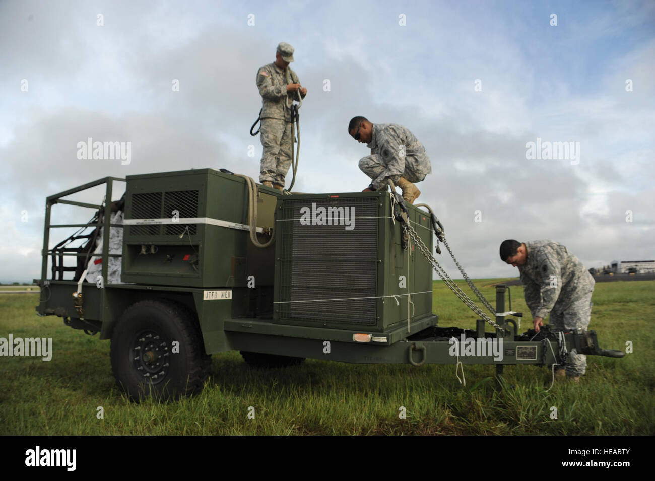 U.S. Army personnel with Joint Task Force-Bravo inspect a 4,823-pound ...