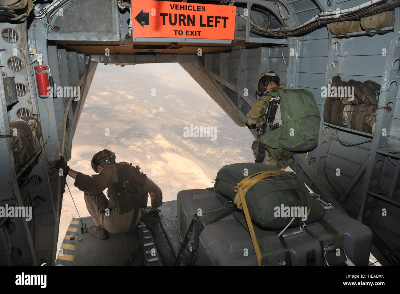 U.S. Marine Corps Cpl. Colton Patterson (left), a Marine Corps CH-53E ...