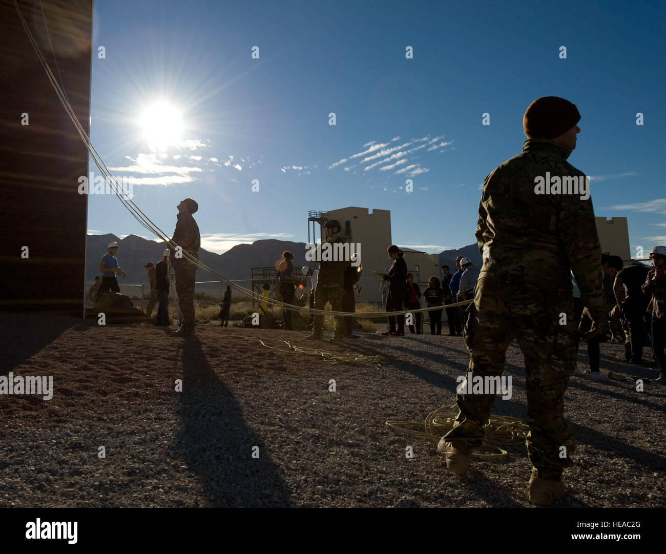 Members of the 58th Rescue Squadron secure the rappelling line for Army ...