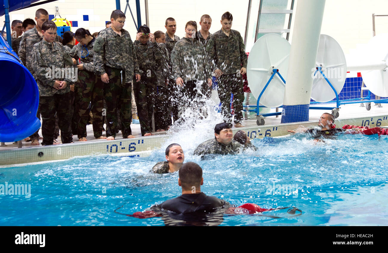 Junior ROTC cadets jump in a swimming pool during a survival-swimming ...