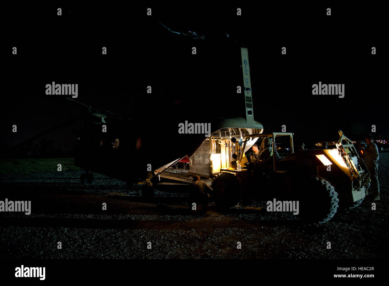 U.S. Army Soldiers load a pallet onto a CH-47F Chinook helicopter at ...