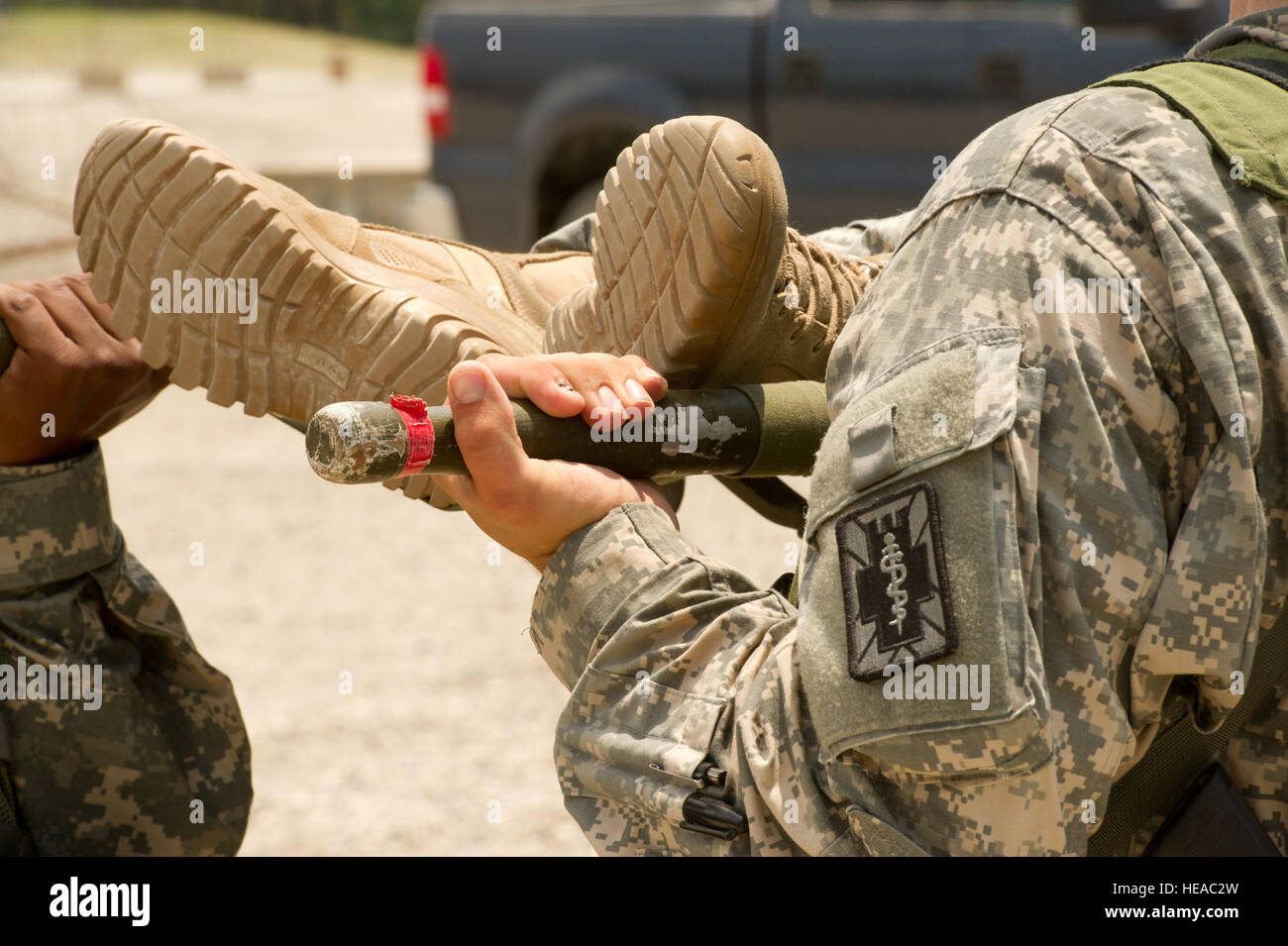 U.S. Army Soldiers carry a simulated patient on a litter during the ...
