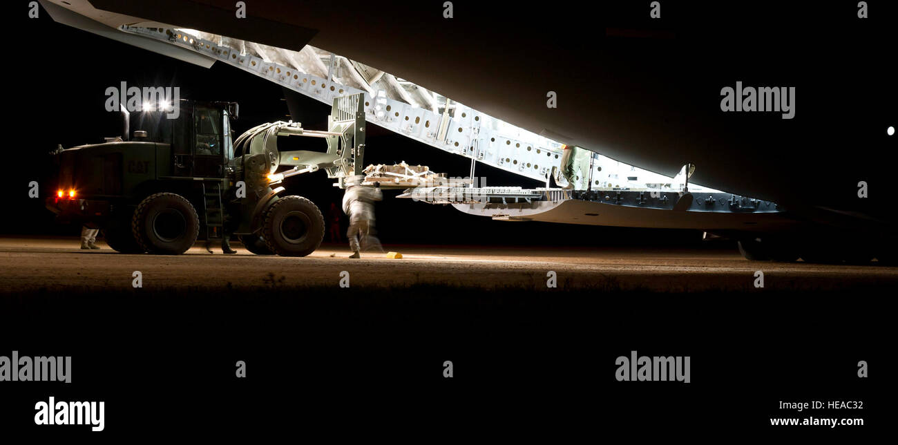 U.S. Air Force service members perform an engine running onload of load ...