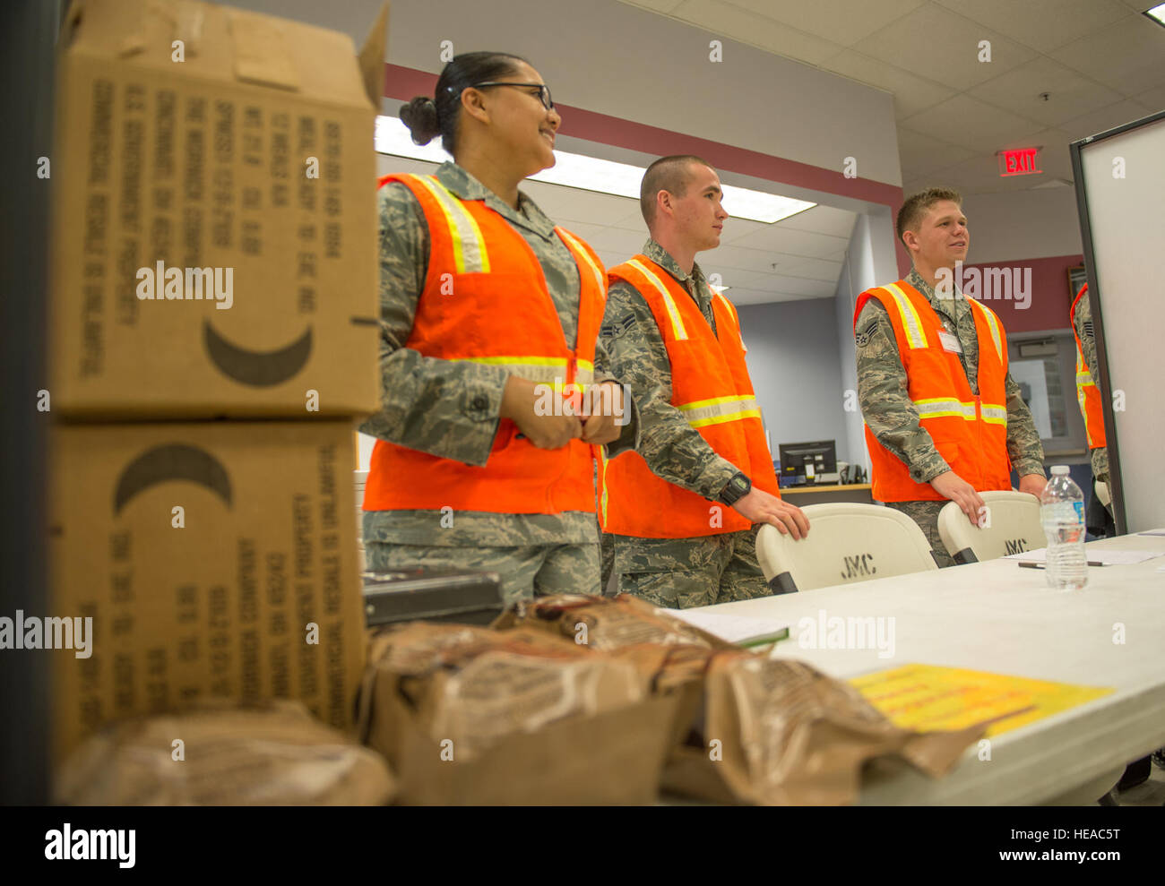 U.S. Air Force Airmen provide services in a pre-deployment briefing ...